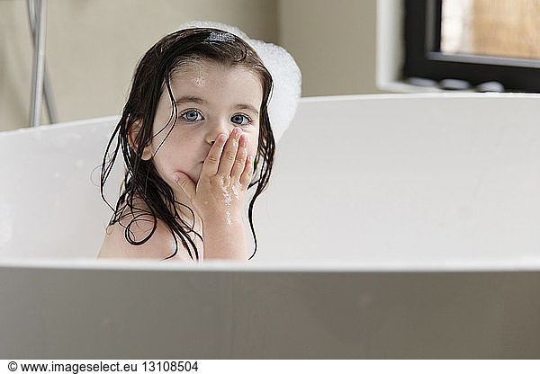 Portrait Of Shirtless Girl Bathing In Bathtub At Home Portrait Of
